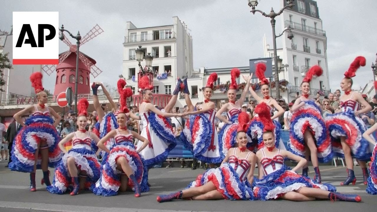 Moulin Rouge dancers perform for cyclists in the Olympics road race | NE