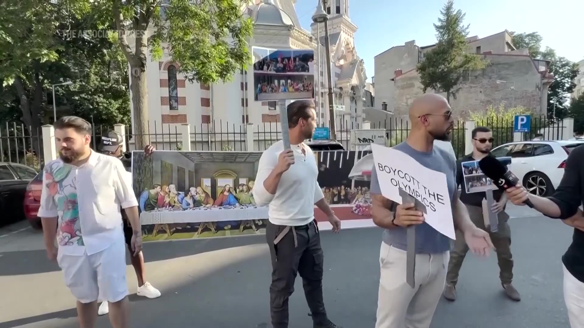 Andrew Tate Protest Last Supper Parody at Olympics