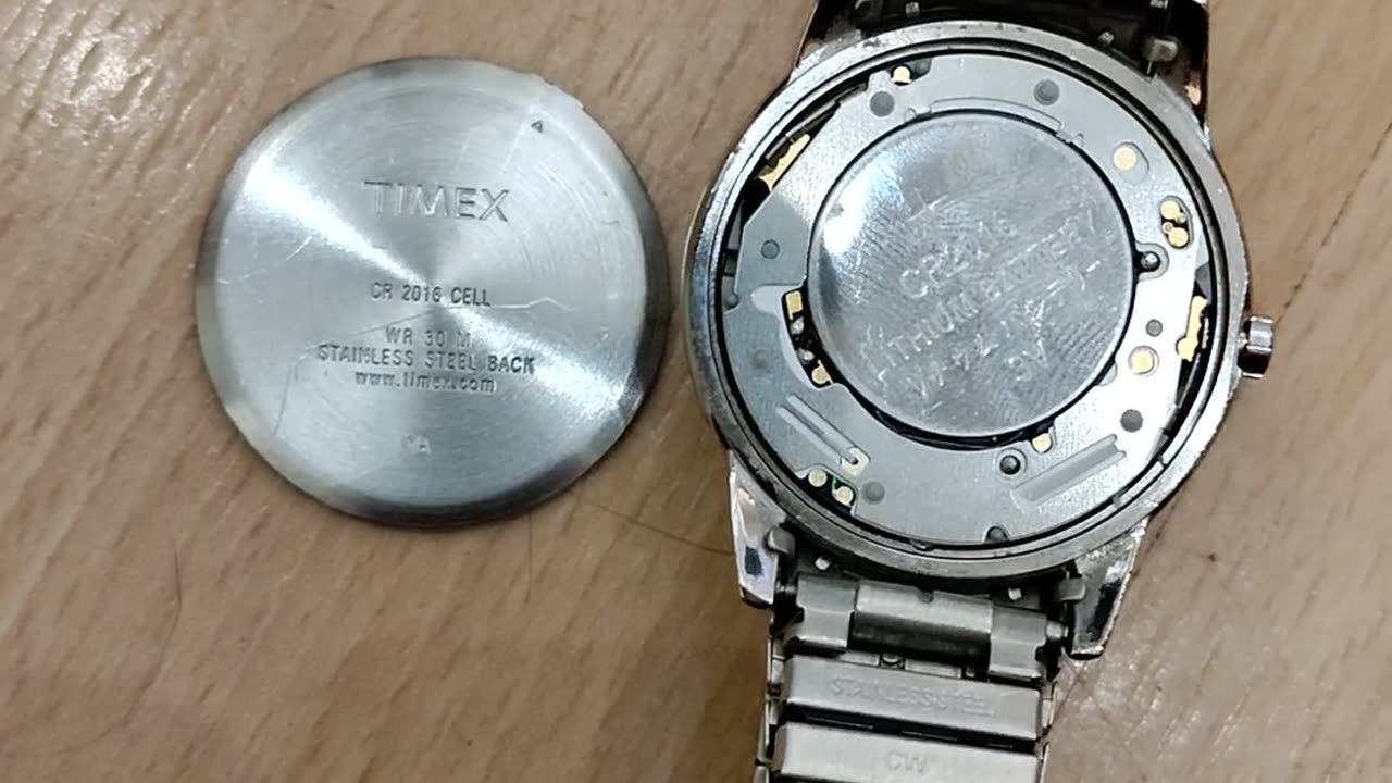 Trying To Put A Battery Cover Back On The Back Of An Analog Timex Watch ...