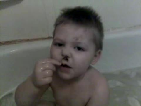 Boy Makes "Poop Mustache" On His Face During Bath Time