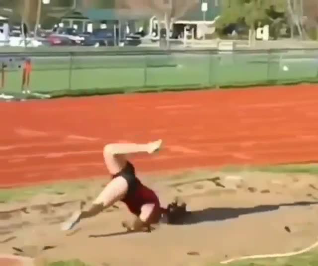 Girl doing long jump gone wrong