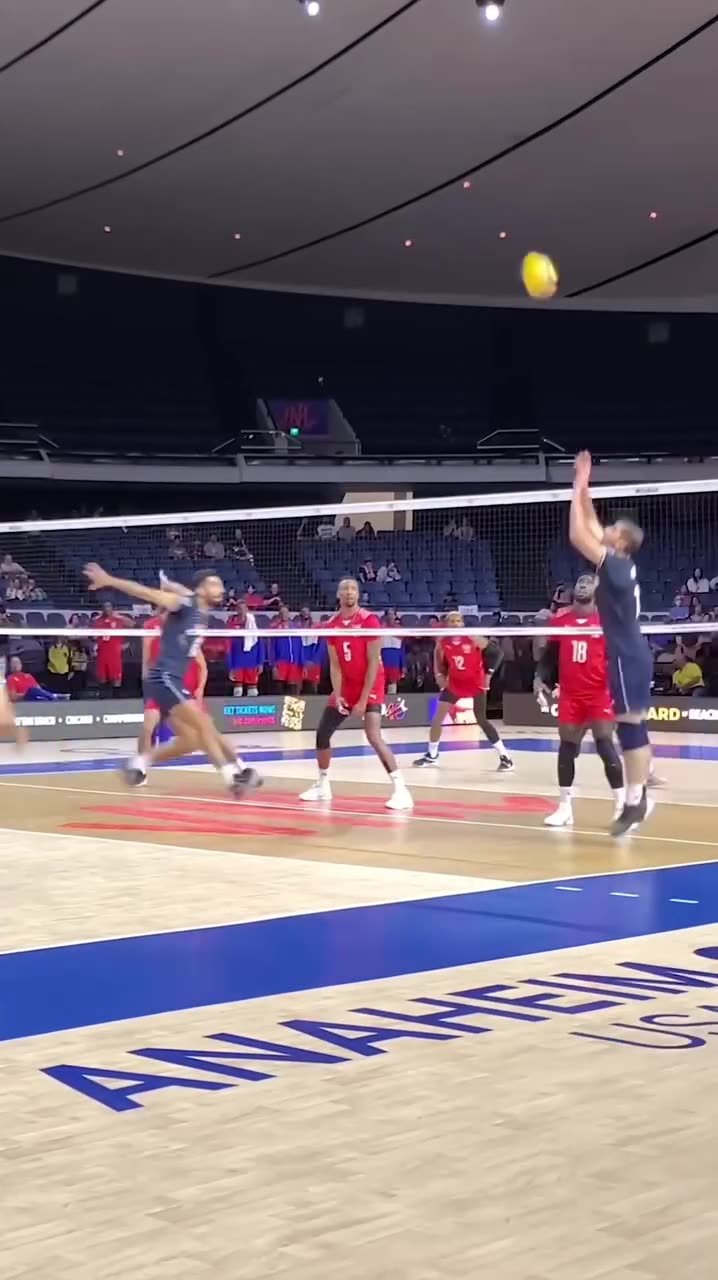 Boys playing shooting valley ball