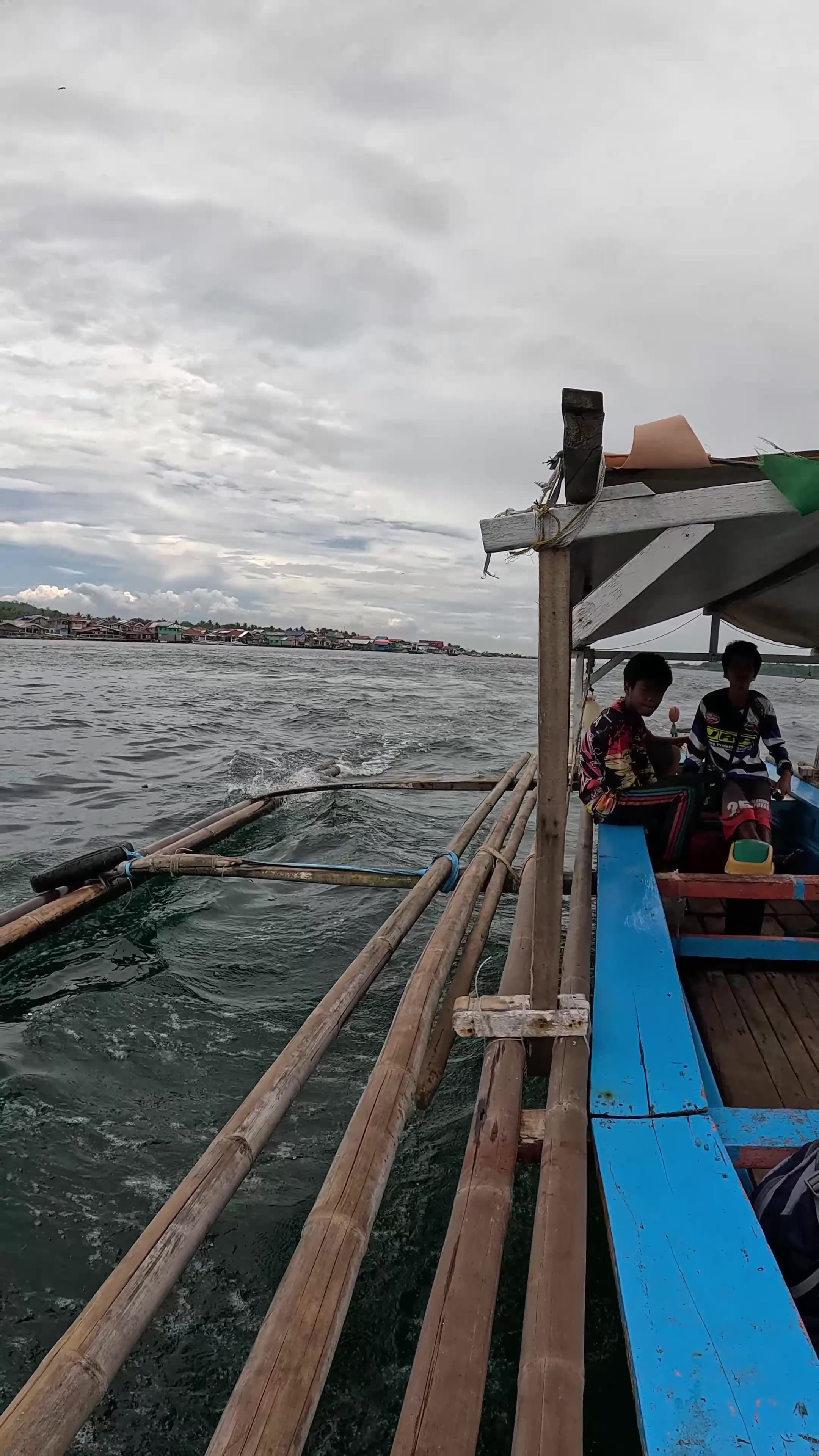A traditional Bangka, motorized outrigger canoe ride from Malamawi ...