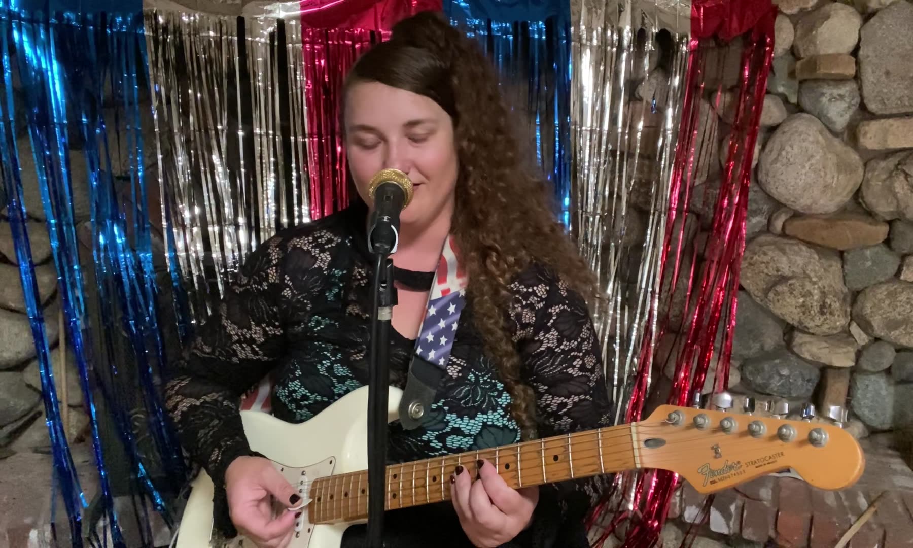 Becca Murder sings through her microphone Slightly Scary Music