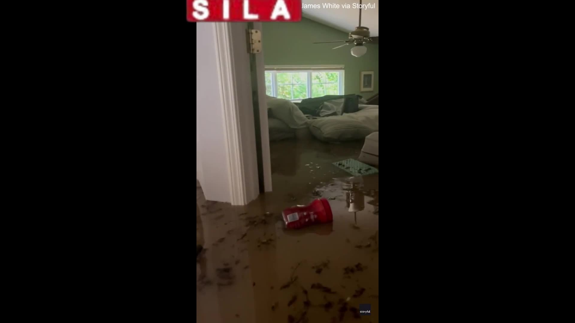 NC residents stand in chest-deep flood water after Hurricane Helene