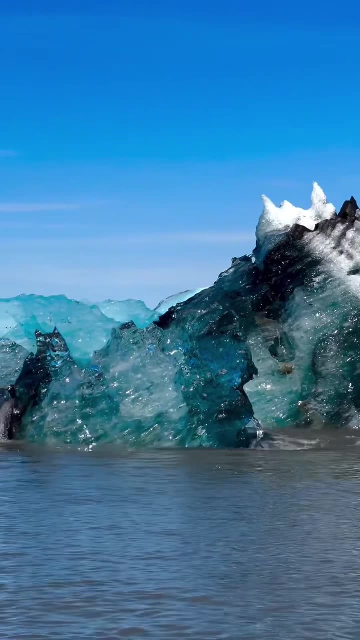 Watch an Iceberg Flip in the Glacier Lagoon 🤩🤗