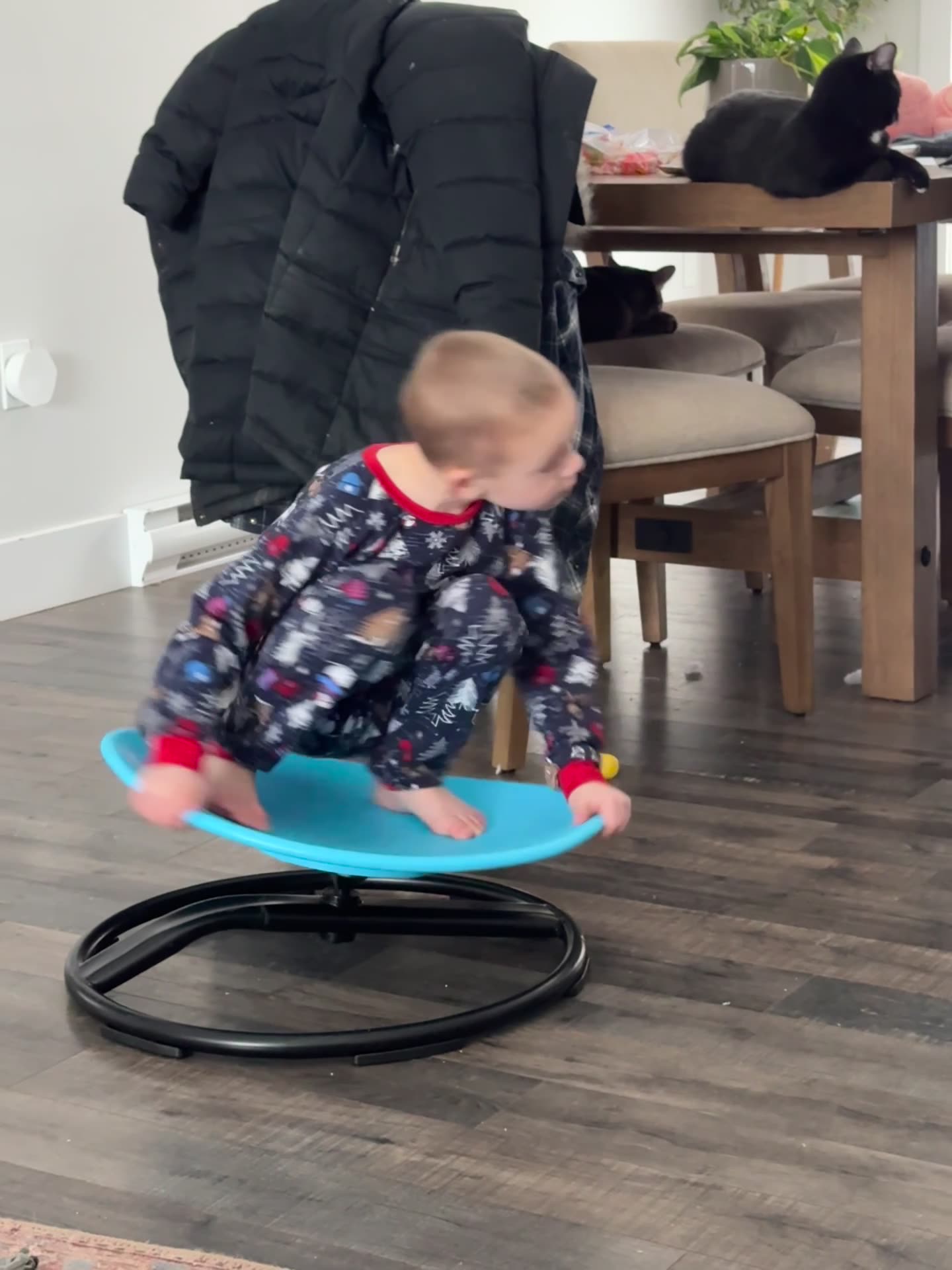 Child Whirls Around On Spin Chair