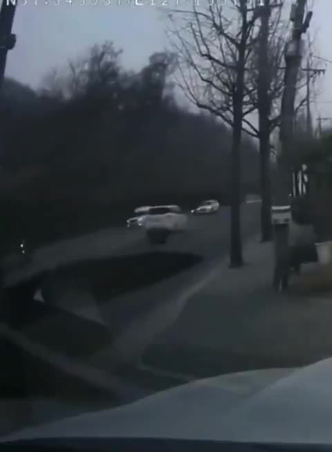 A motorcyclist was swallowed by a hole about 20 meters (65 feet) deep ...