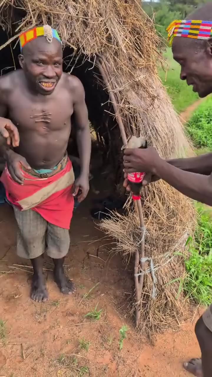 Hadzabe Tribe bushmen see coca cola for the first time in their life