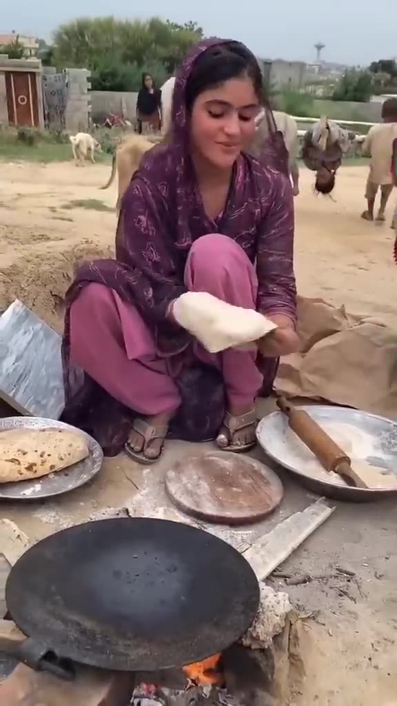 Desi girl making roti village Pakistan