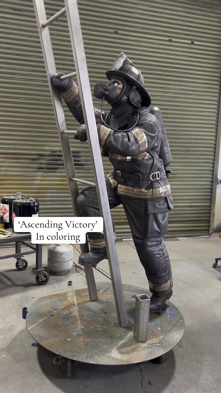 “Ascending Victory” firefighter climbing a ladder