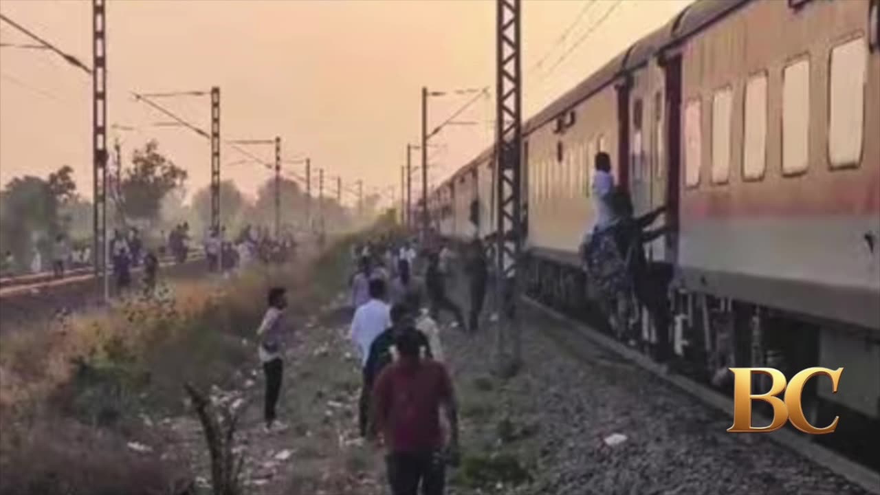 At least 12 passengers dead after jumping onto tracks over train fire ...