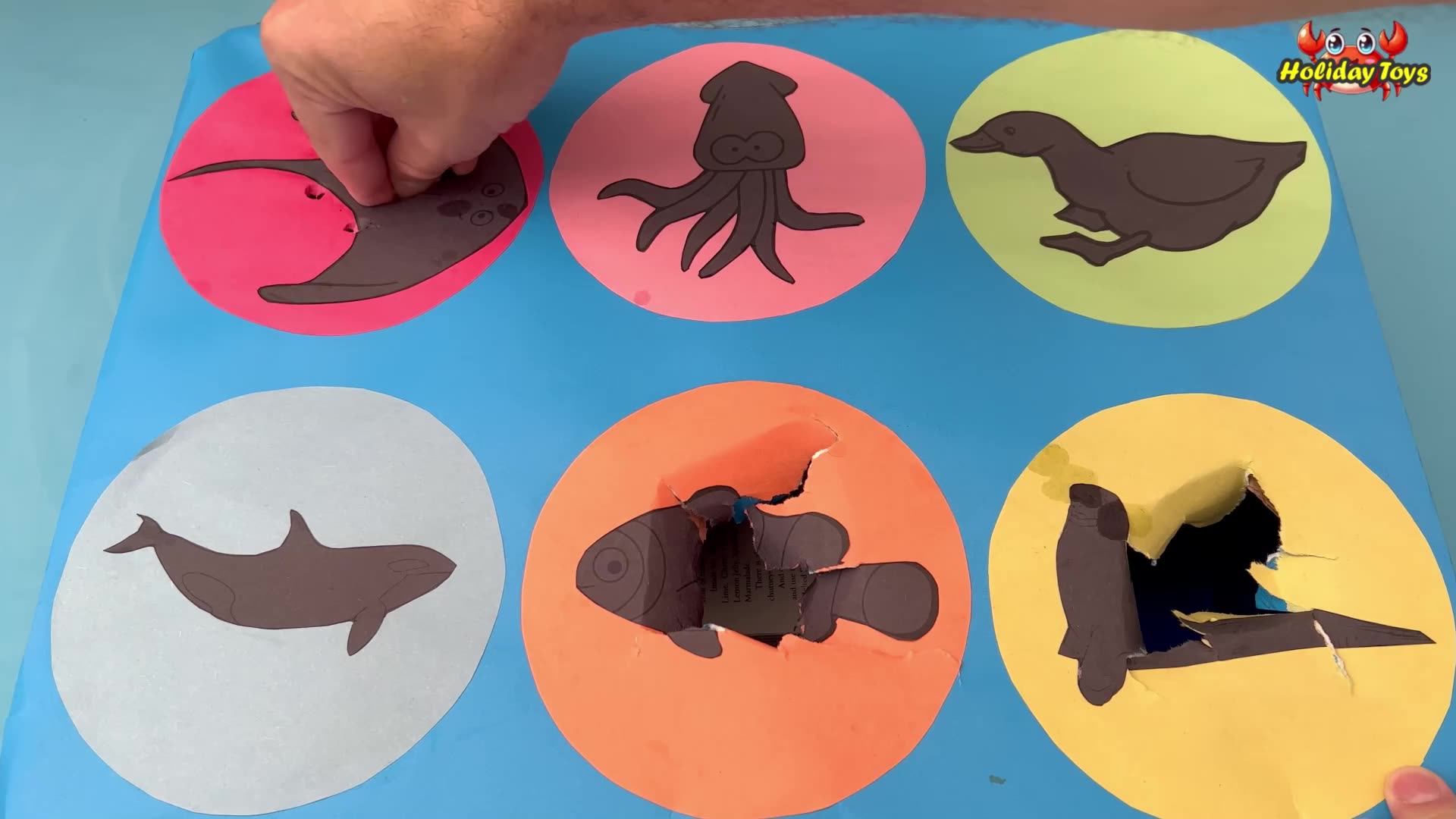 Hole Punching Paper Game with Animals Inside