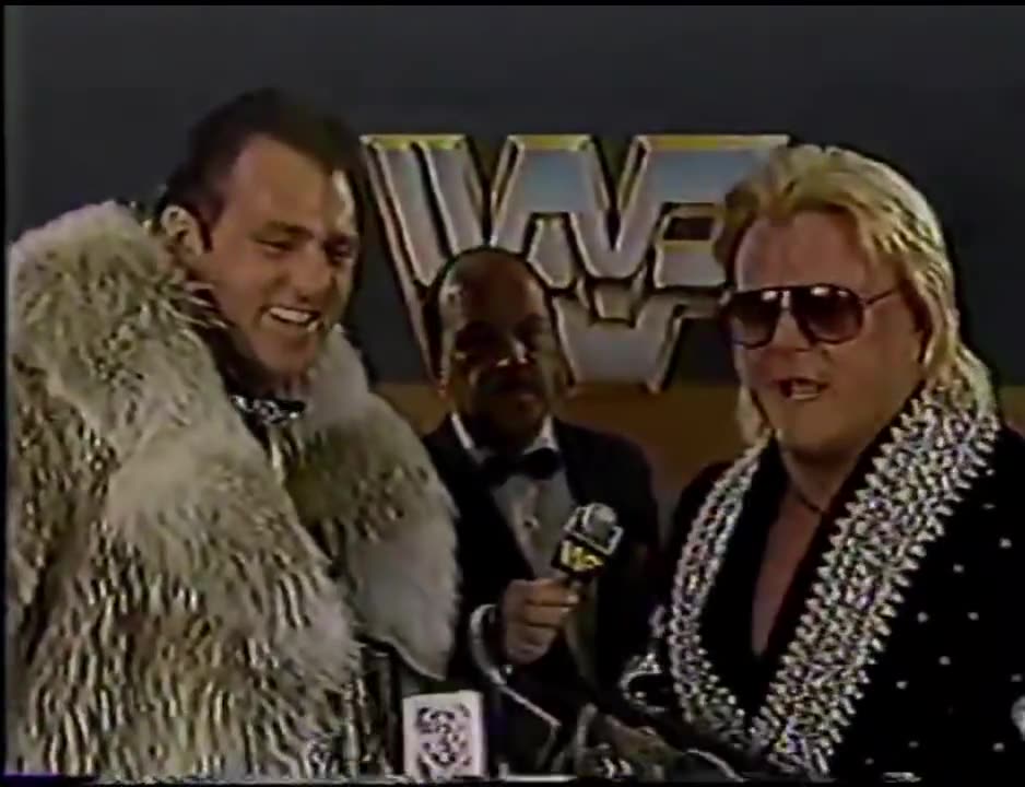 Brutus beefcake in fur coat with Greg valentine-tag team champs