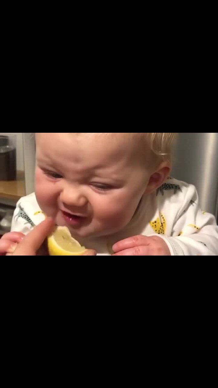 Baby tries lemon for the first time and totally wants more