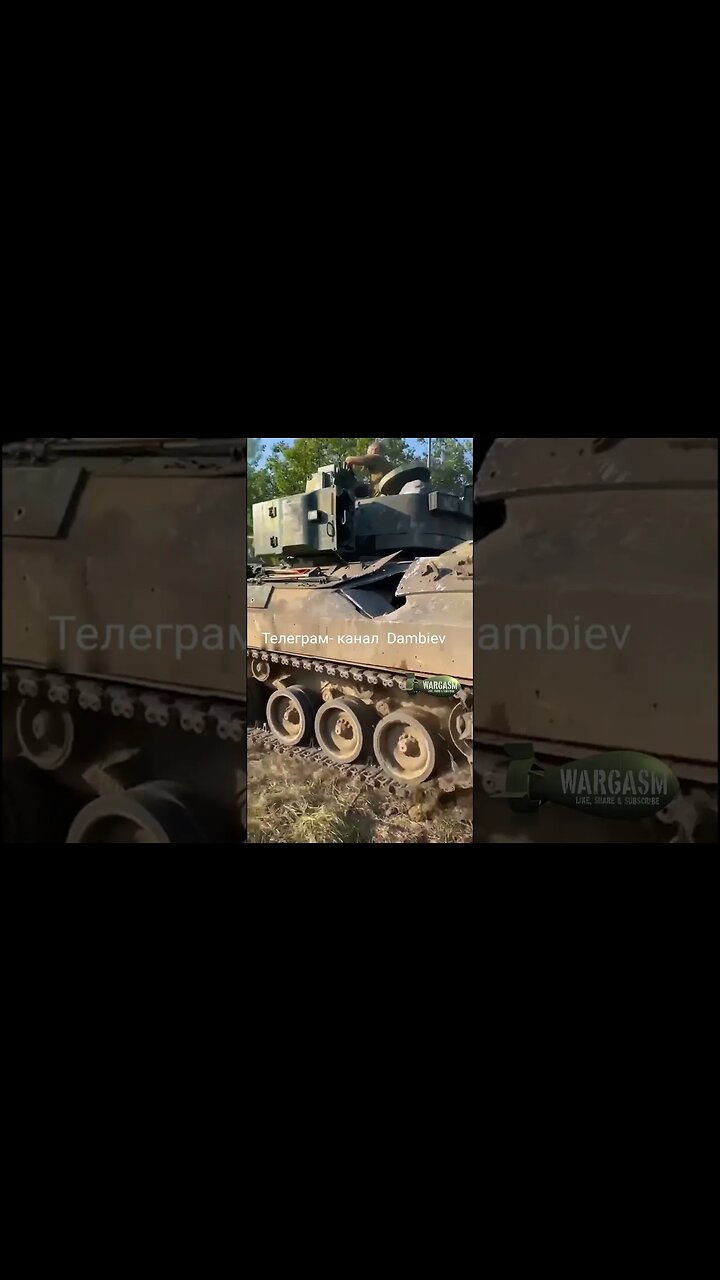 Bradley fighting vehicle with a hole after being hit by a tank shell