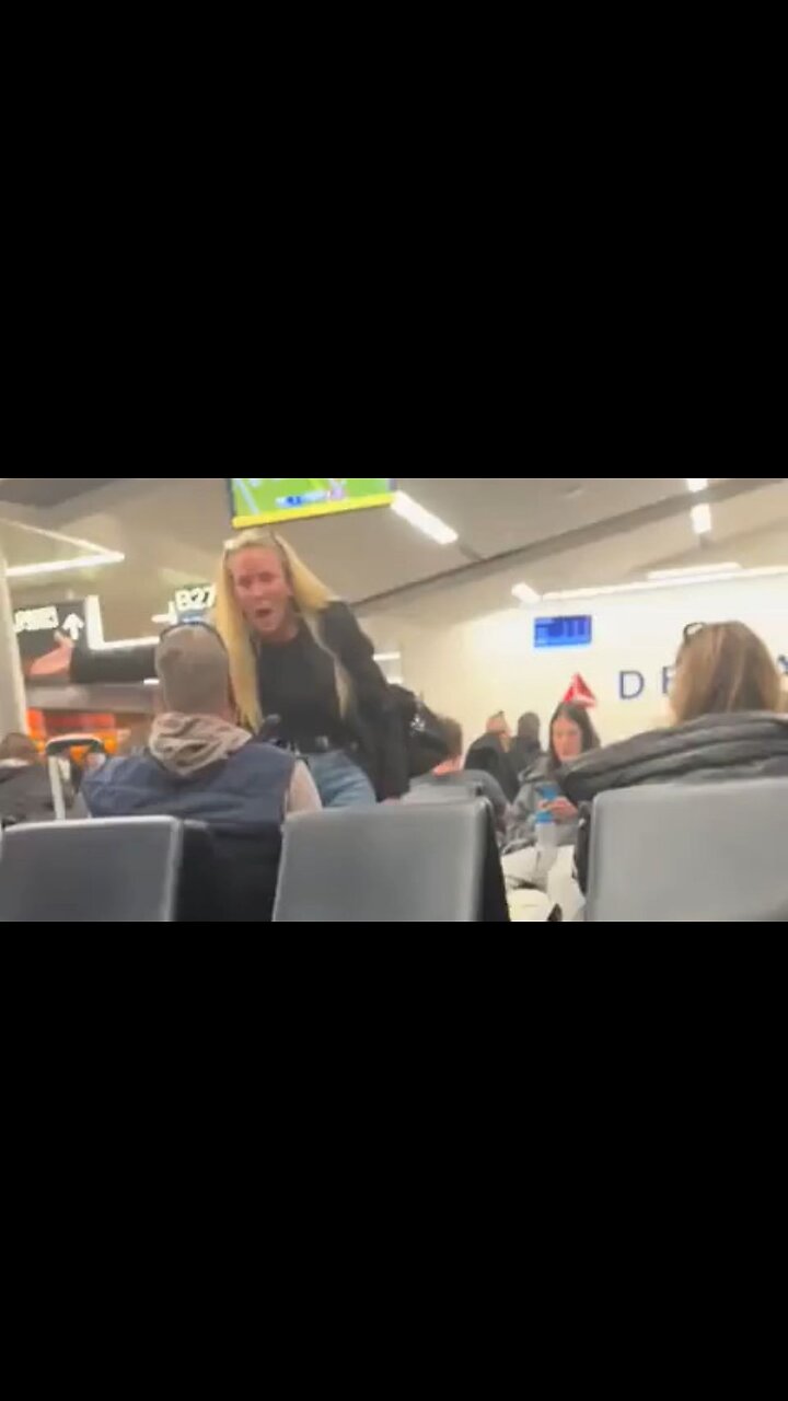 Insane Woman Walks Up To Man She Doesn't Know And Screams Nonsense At Him At Atlanta Airport