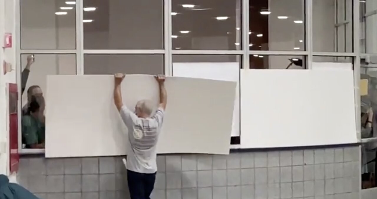 Officials COVER Windows at Detroit's Absentee Ballot Counting Center