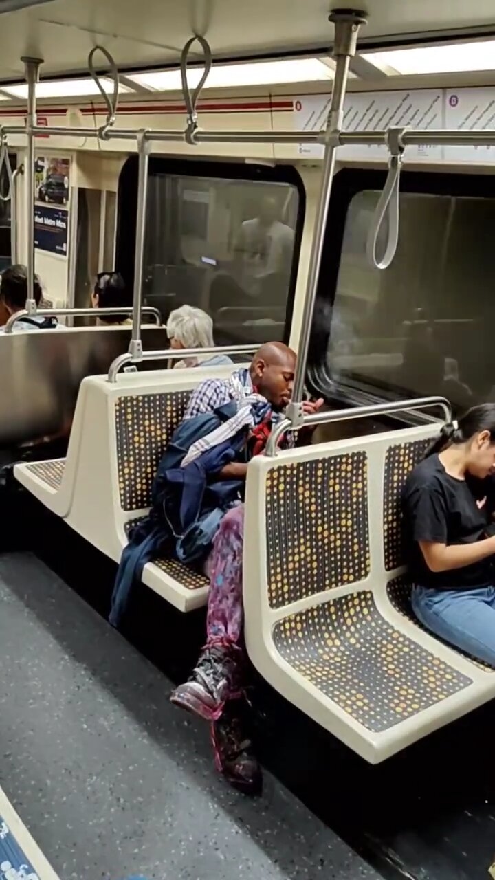 Man smoke meth on LA Metro train with riders sitting right next to him
