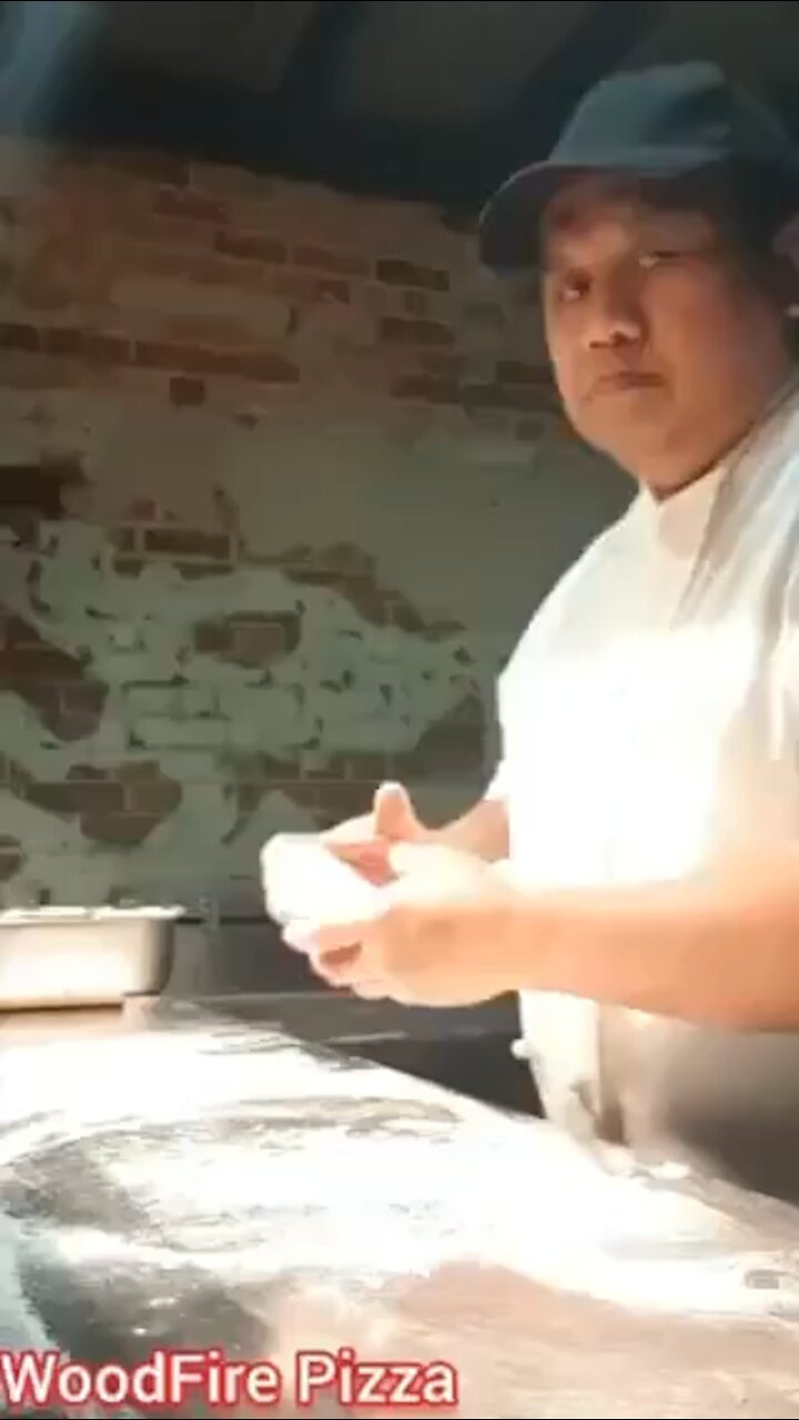 Making Pizza in woof fire oven