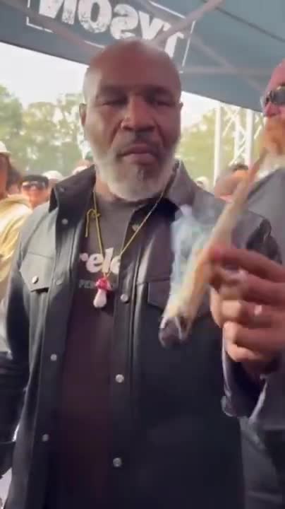 Mike Tyson SPOTTED Smoking KING SIZE weed in the streets!