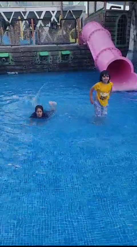 Kids enjoying in the swimming pool