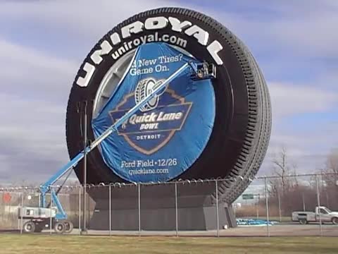 Quicklane Bowl Banner on the Uniroyal Giant Tire