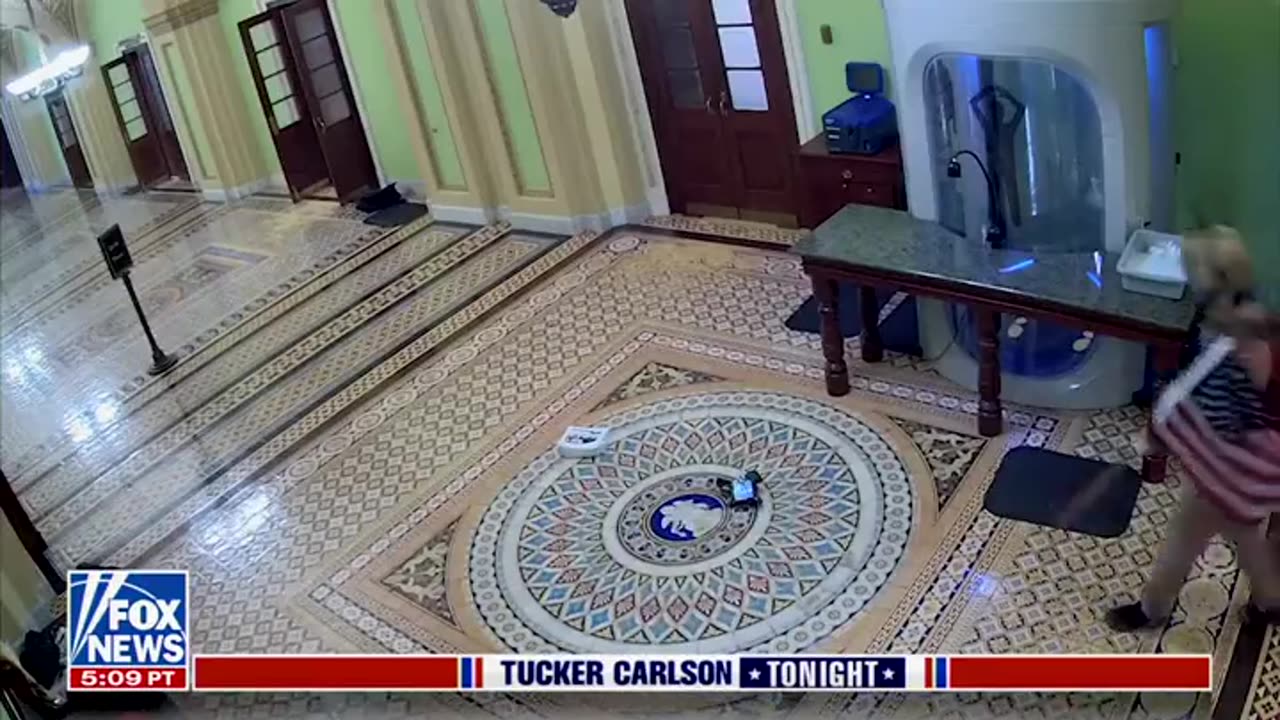 Jacob Chansley, the QAnon Shaman, being led through the Capitol by ...