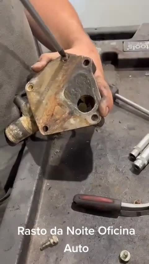 The small parts in the car engine are removed