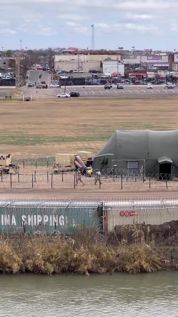 Shipping Containers Lined With Barbed Wire Setup & Are Patrolling The ...