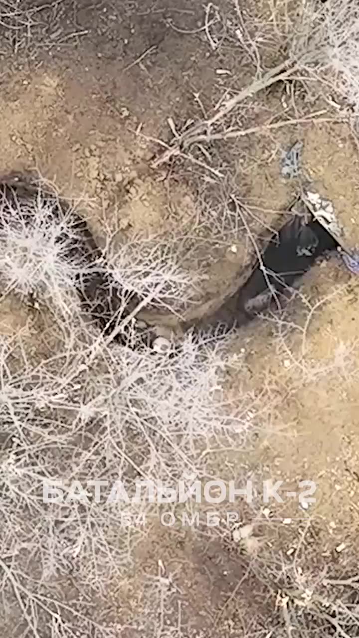 Ukrainian Soldier Working to Clear a Russian Dugout