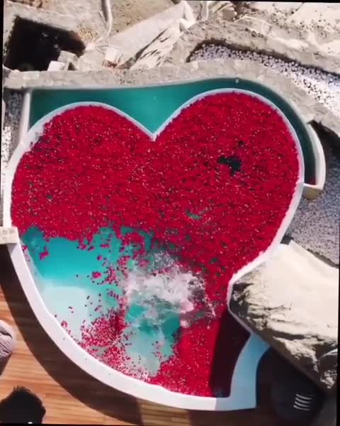 ENGLISH COUPLE JUMPED INTO HEART SHAPE POOL