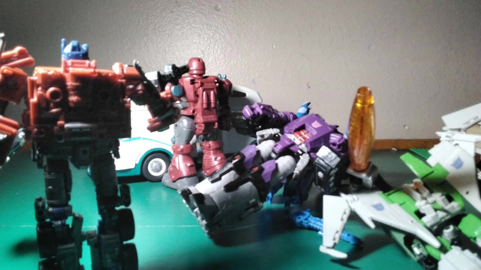 Optimus Prime dominating in the battlefield against the Decepticons