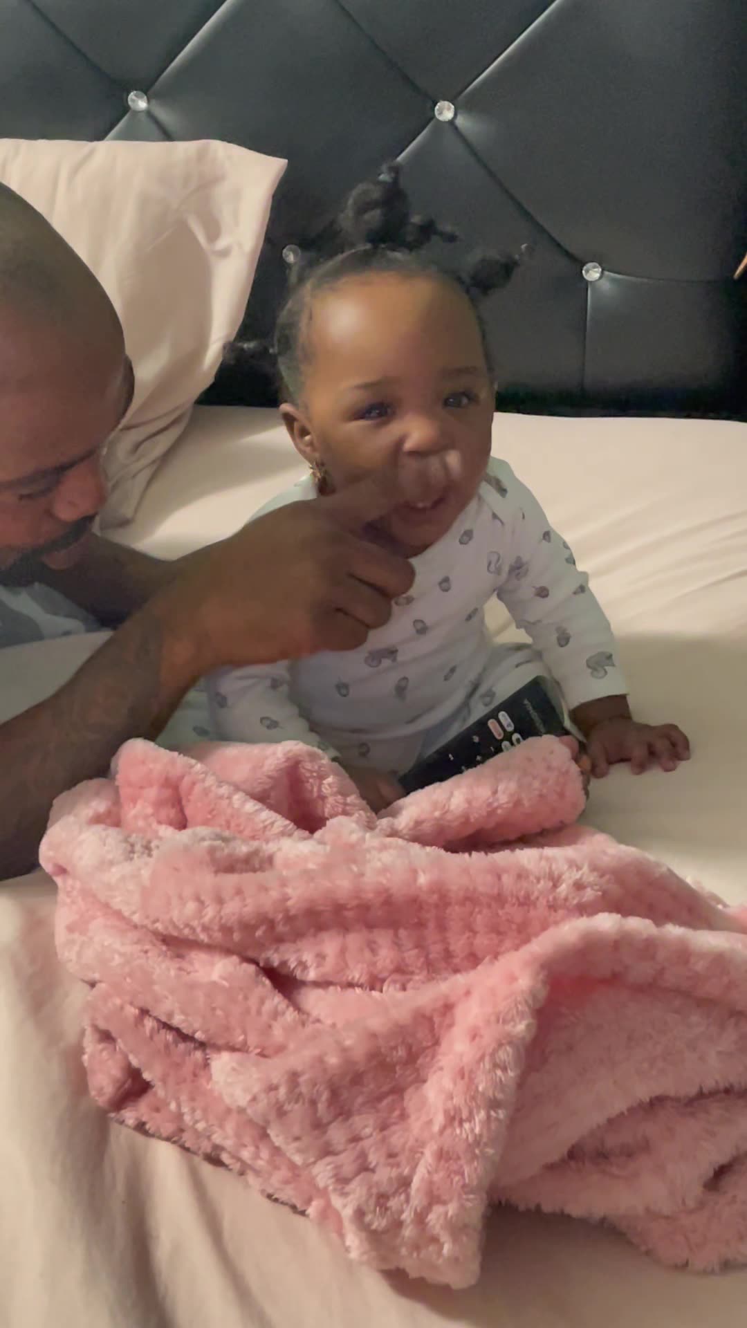 Dad Is Playing With Baby Biting Finger
