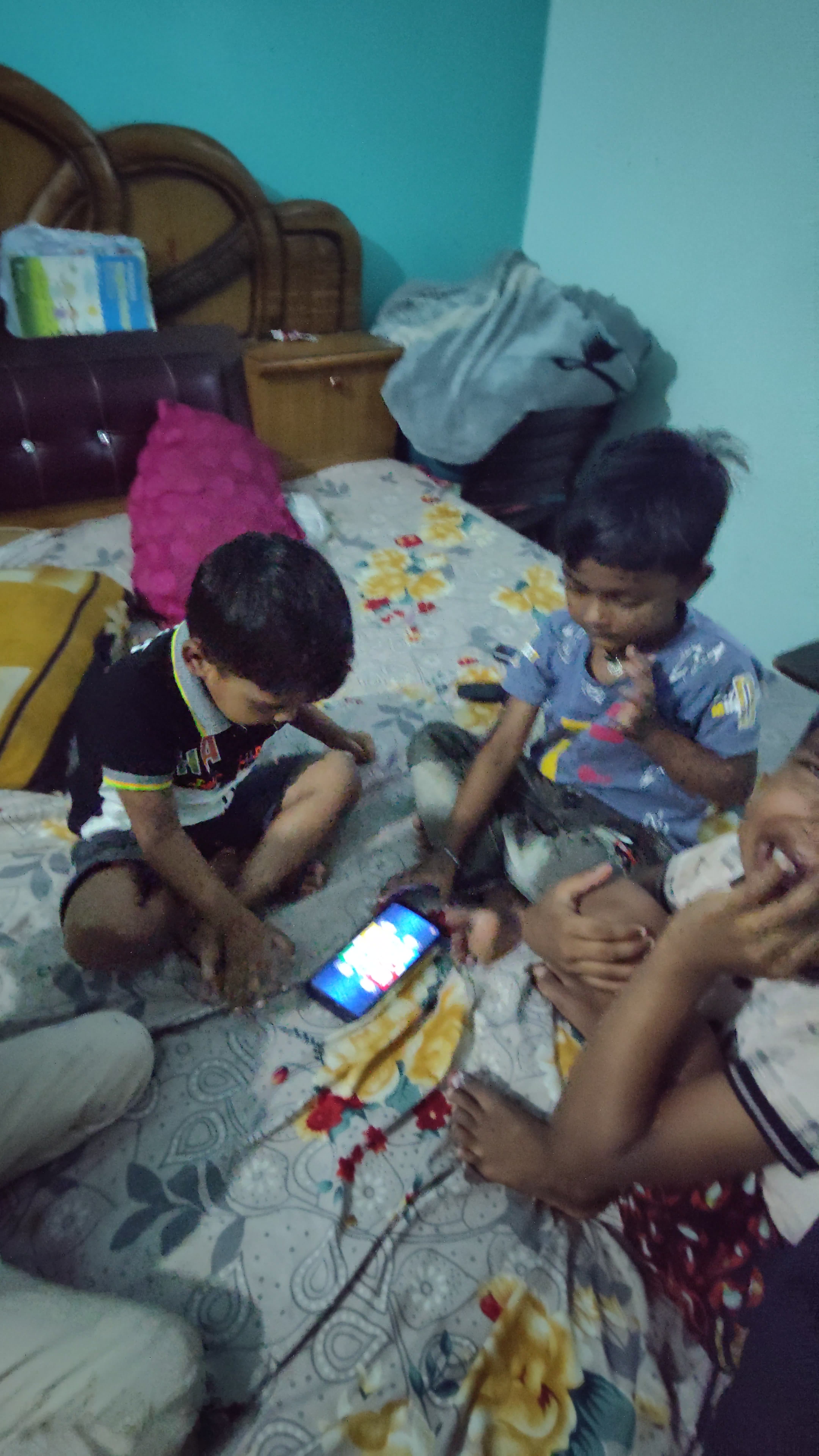 Kids play lodu game in India