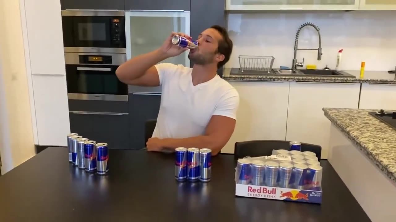 Tristan Tate breaks the Guinness World Record for most cans of Red Bull ...