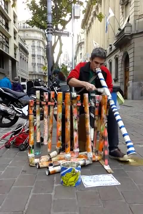 Street drummer wows spectators with plastic pipe jam