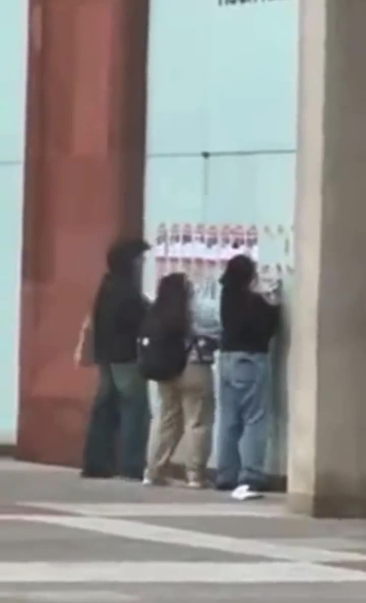 Students at New York university rip down posters of the missing people ...