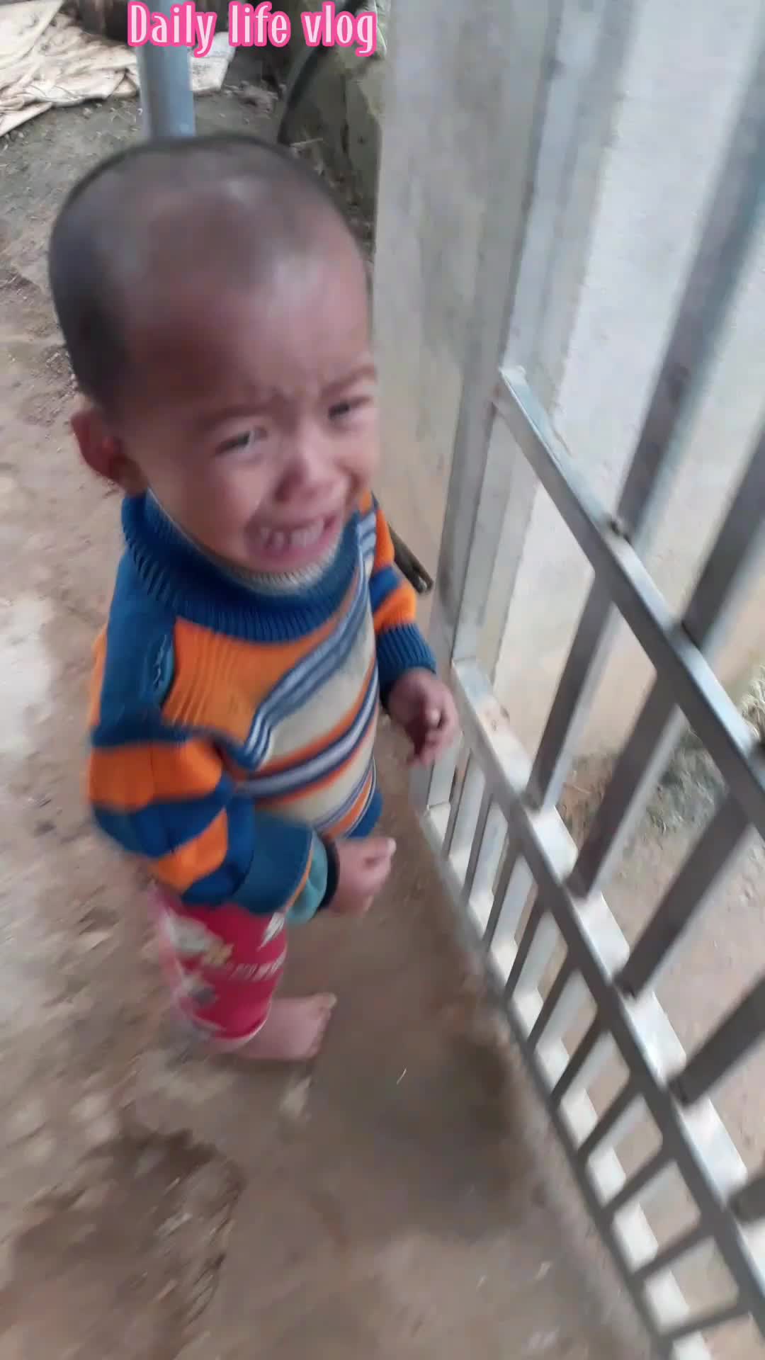 baby crying outside the gate waiting for mom