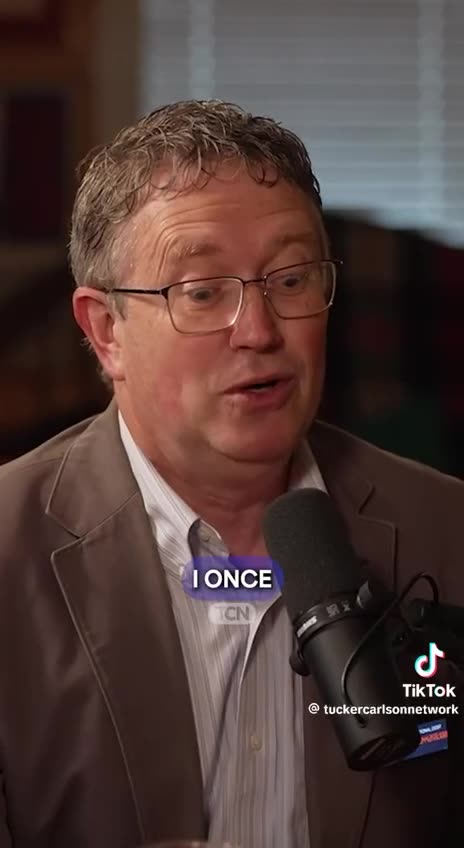 Rep Massie wears a debt clock pin