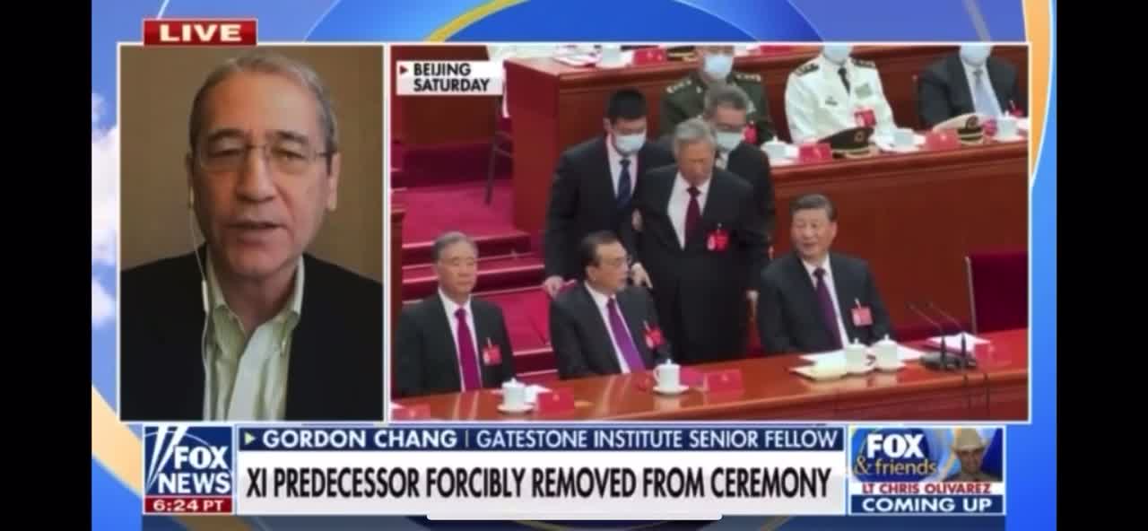 Xi is kept as chief of the CCP as his successor is led out of the chamber