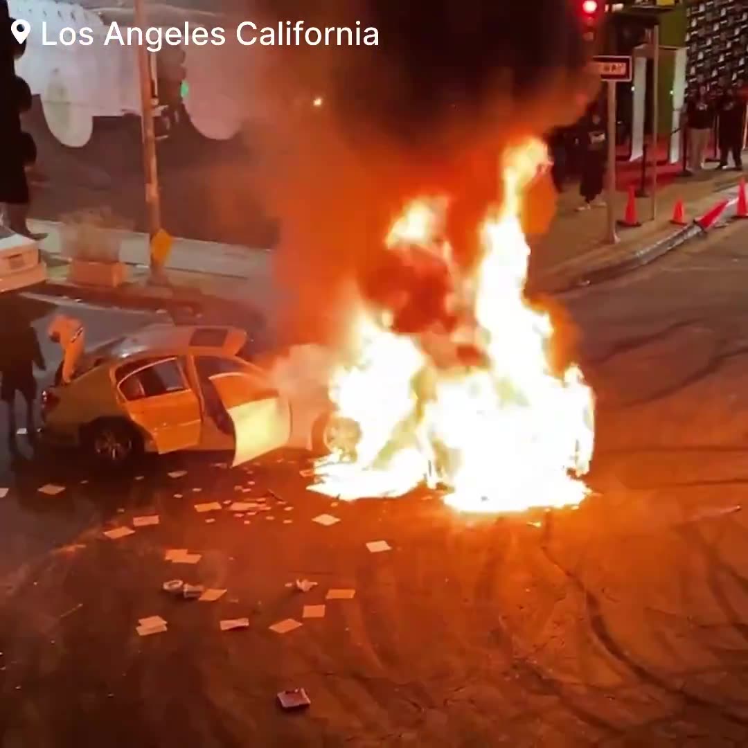 Emergency personnel respond to Vehicles on fire and explosions at a ...