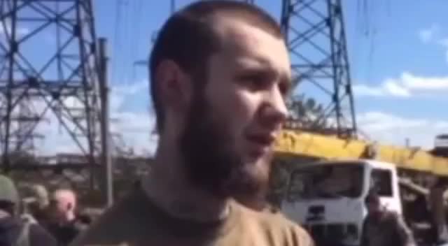 Azovites has swastikas on his body and the emblem of the SS division ...