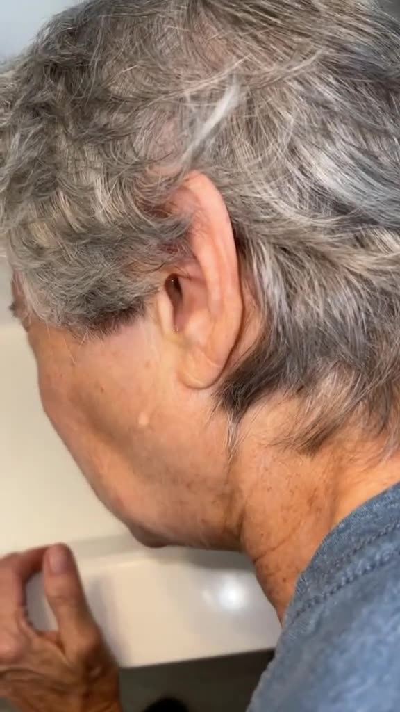 Spider comes out of a woman's ear.